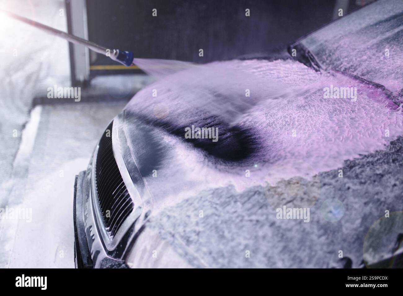 Car hood being cleaned with foam and a water spray Stock Photo - Alamy
