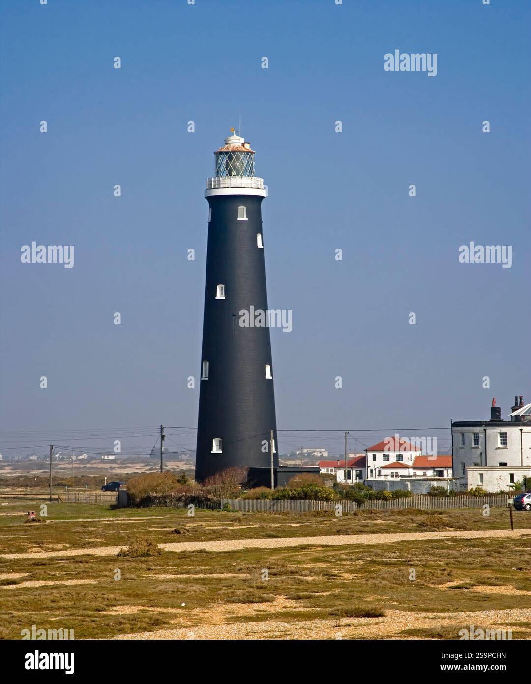 old black lighthouse on the beach at dungeness on the kent coast Stock ...