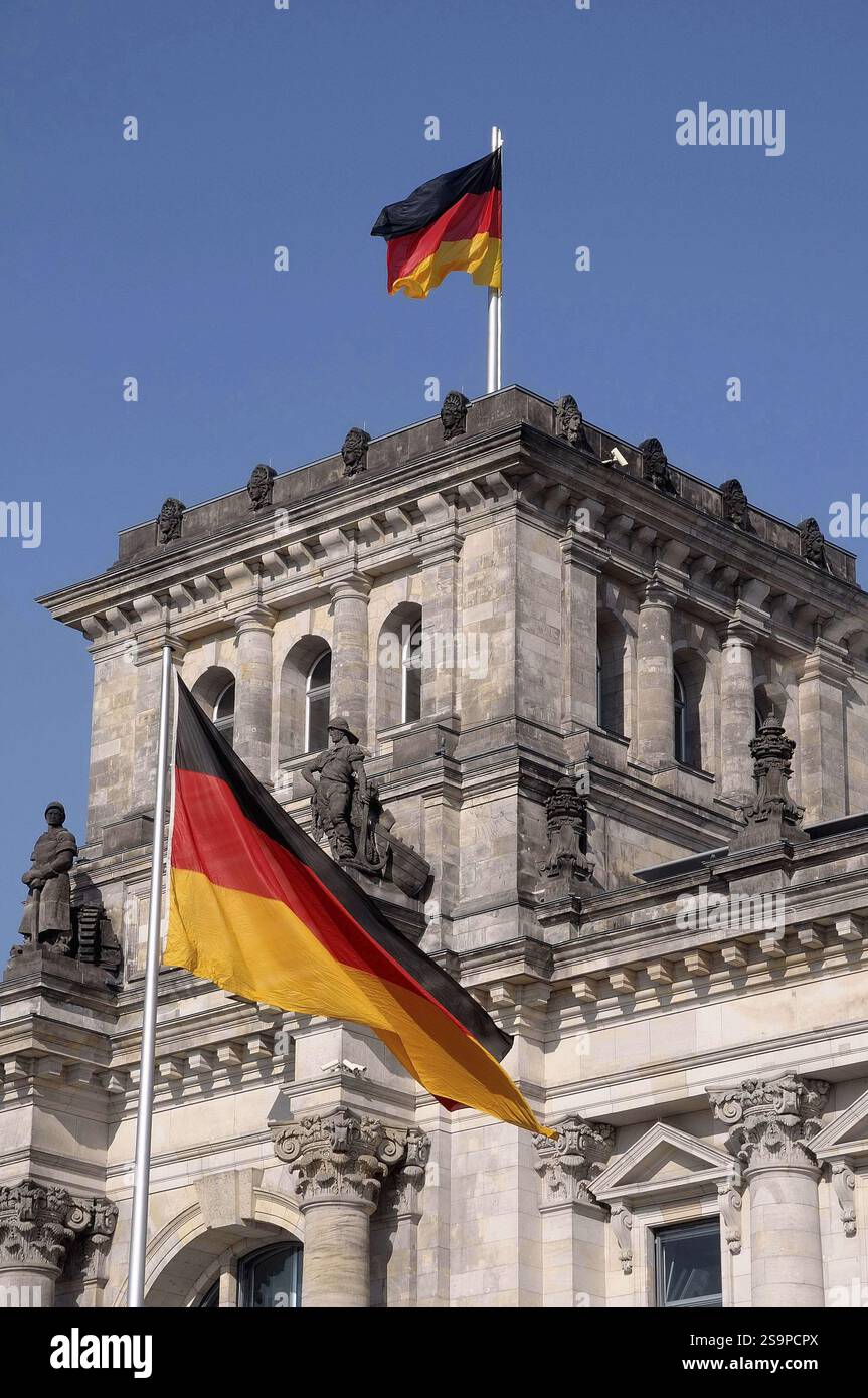 The Reichstag building with German flag in front of a clear blue sky ...