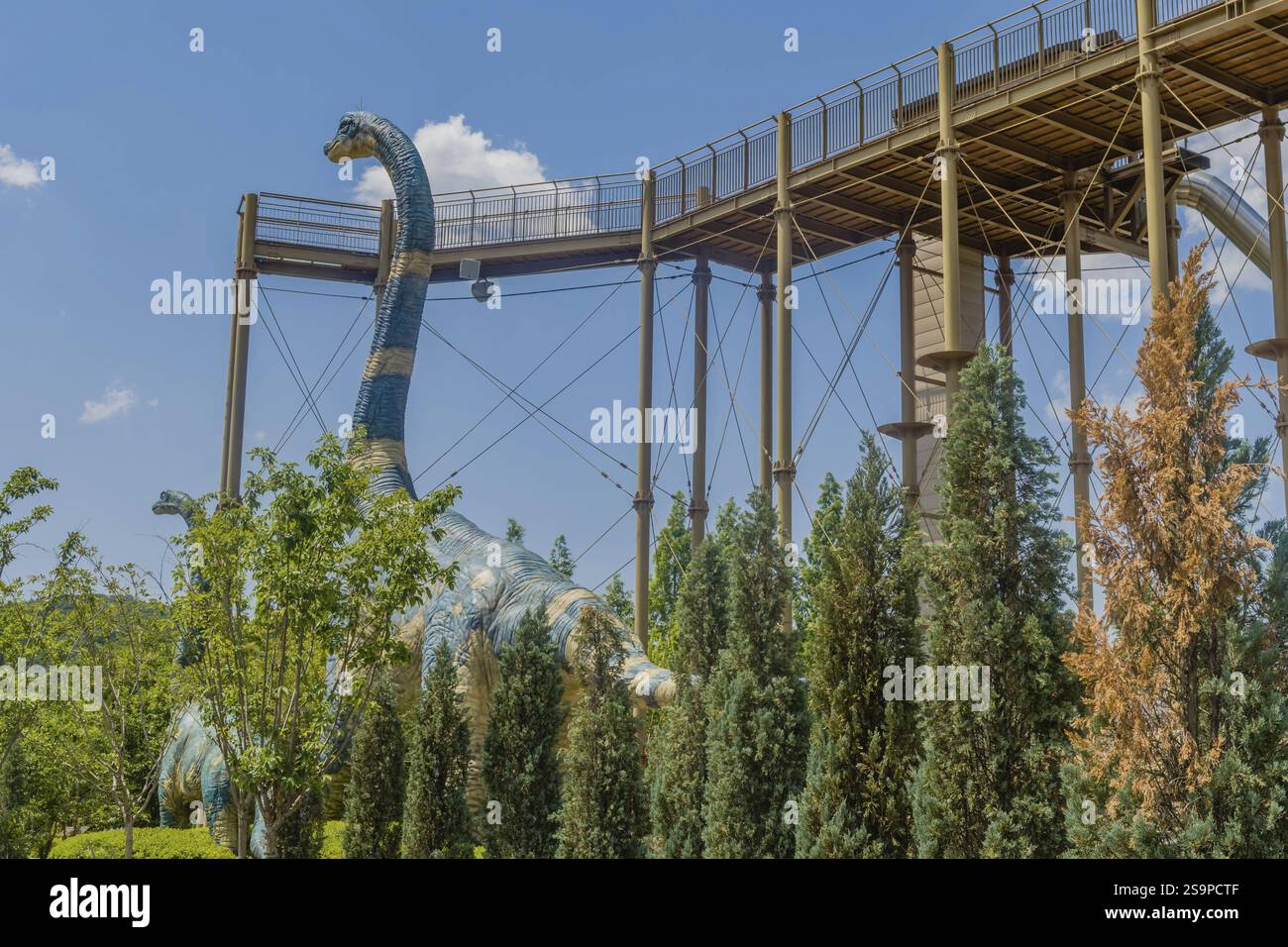 Iksan, South Korea, May 25, 2023: Brontosaurus statue among trees ...