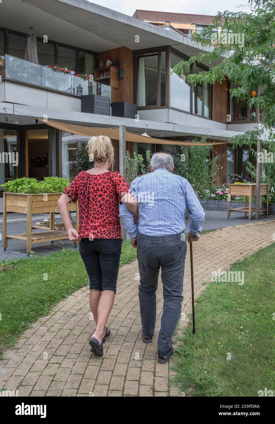 Going for a walk together. Patients in geriatric care home. Elder ...