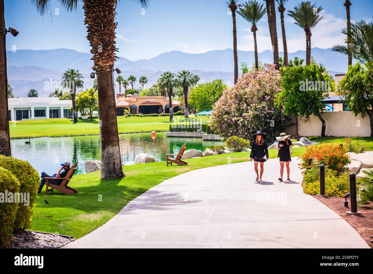 Palm Desert, CA USA - May 6, 2018: Guests strolling garden path at at ...