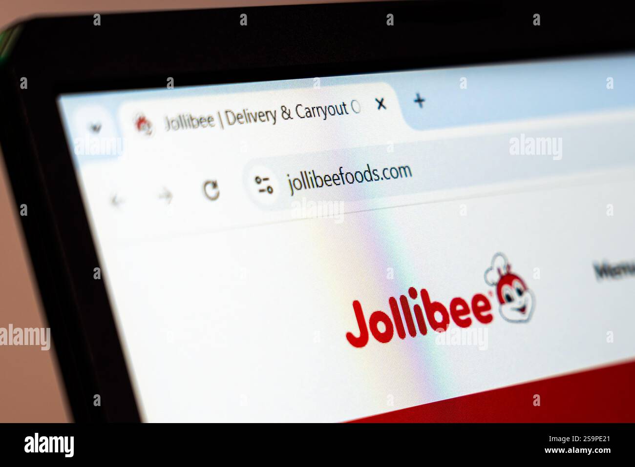 New York, USA - January 20, 2025: Jollibee website displayed on a screen for fast food delivery ...