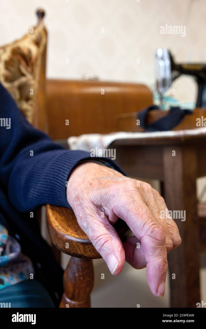 HResting hand of an old man in a chair. Patients in geriatric care home ...