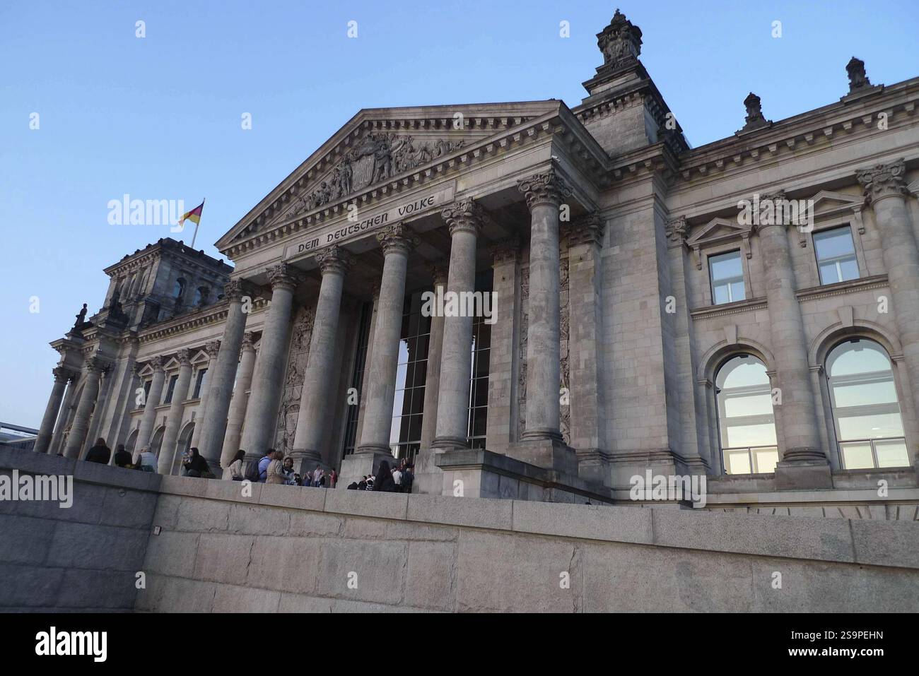 Monumental building with columns, facade and German flag, Berlin ...