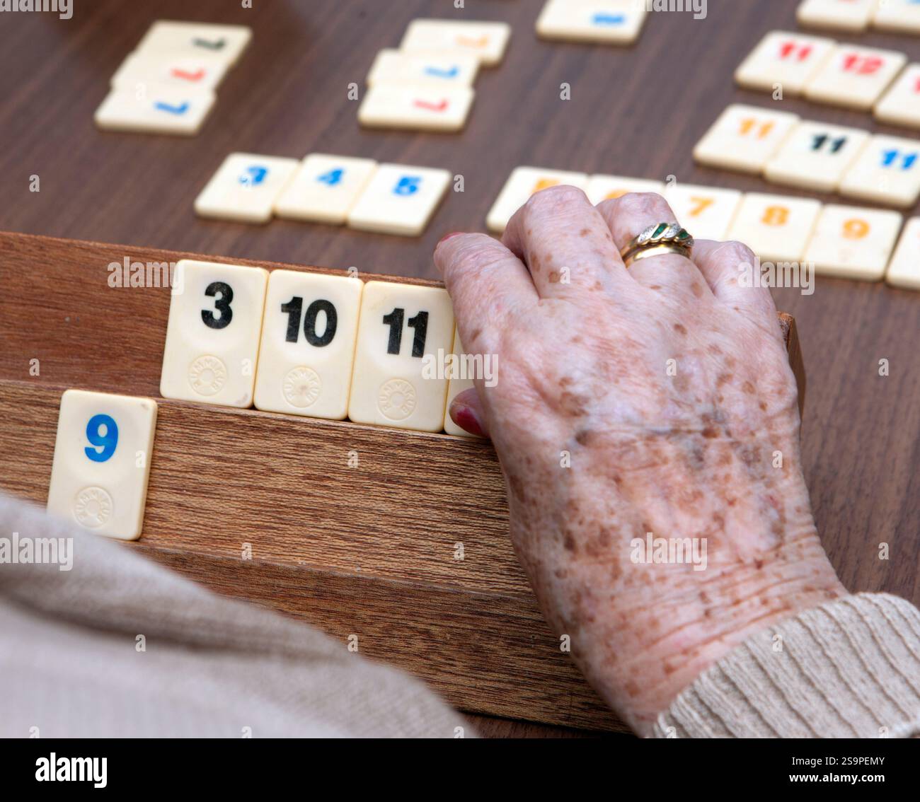 Playing a boardgame together. Patients in geriatric care home. Elder ...