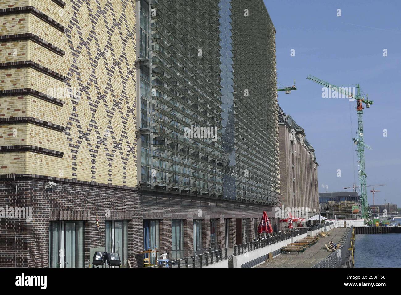 Modern buildings with striking facades on an urban riverbank, visible ...