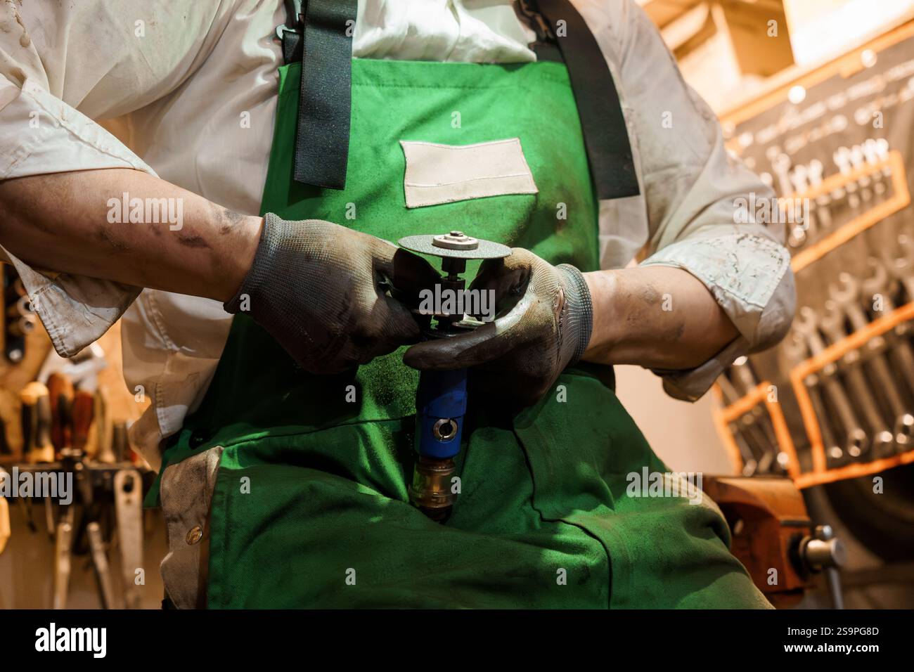 Skilled Craftsman Repairing Tools in a Workshop Stock Photo - Alamy