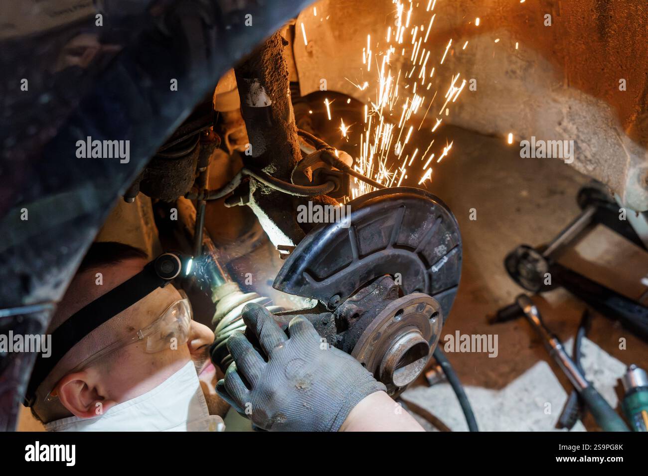 Mechanic Welding Sparks in Automotive Repair Shop Stock Photo - Alamy