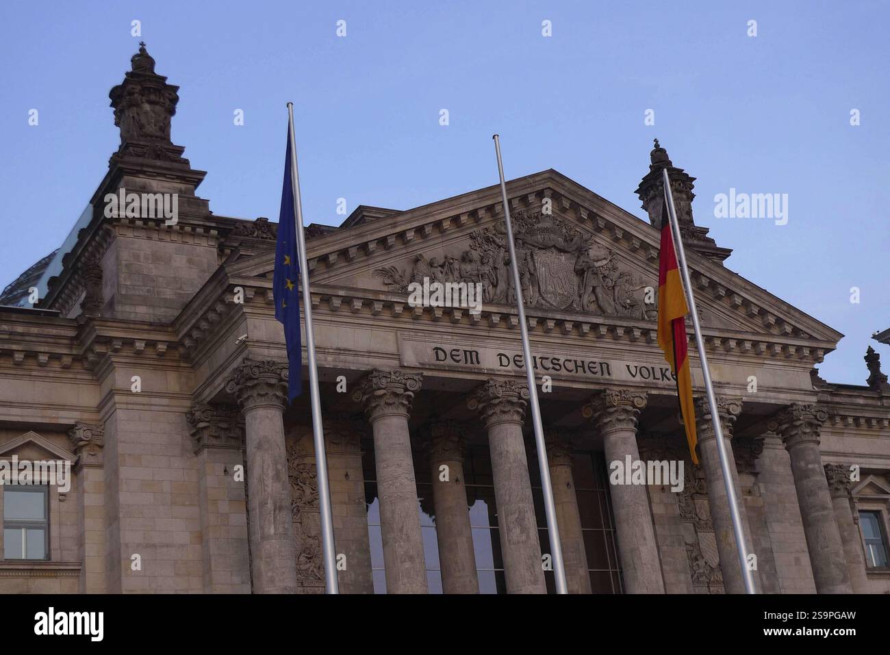 Detailed view of the Reichstag building with inscription and flags ...