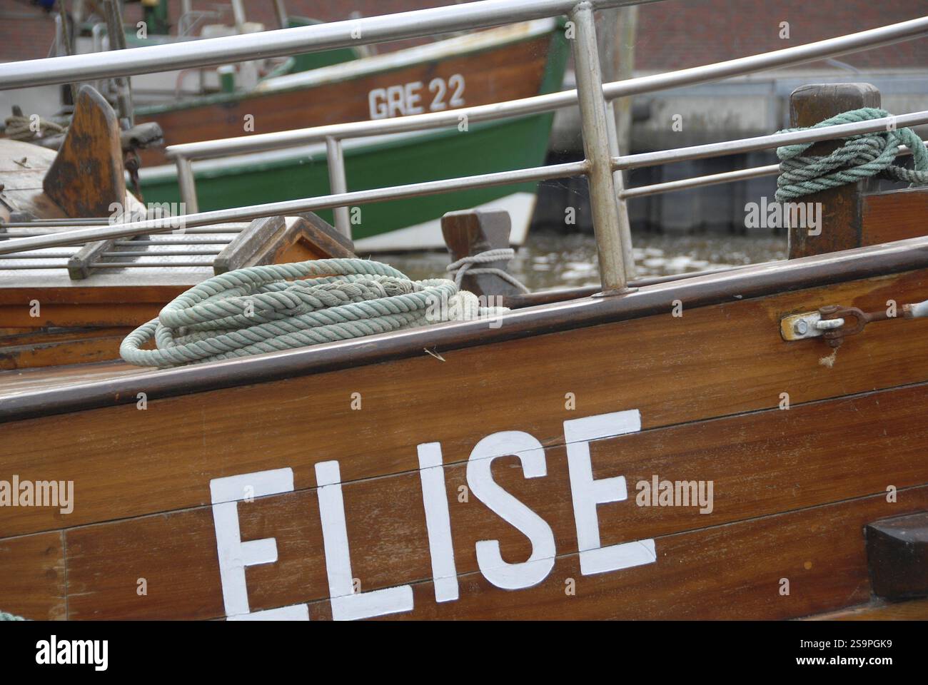 Boat with the name 'ELISE' partly covered by railing, greetsiel, east ...