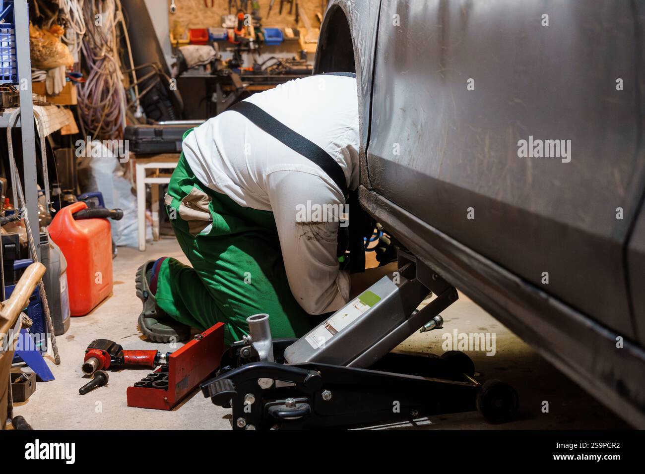 Mechanic performing engine repair hi-res stock photography and images ...