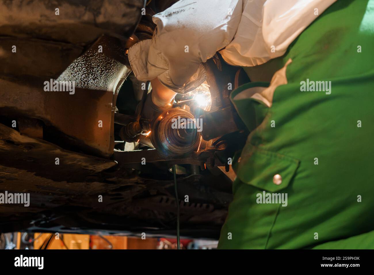 Mechanic Performing Detailed Maintenance Underneath a Vehicle Stock ...