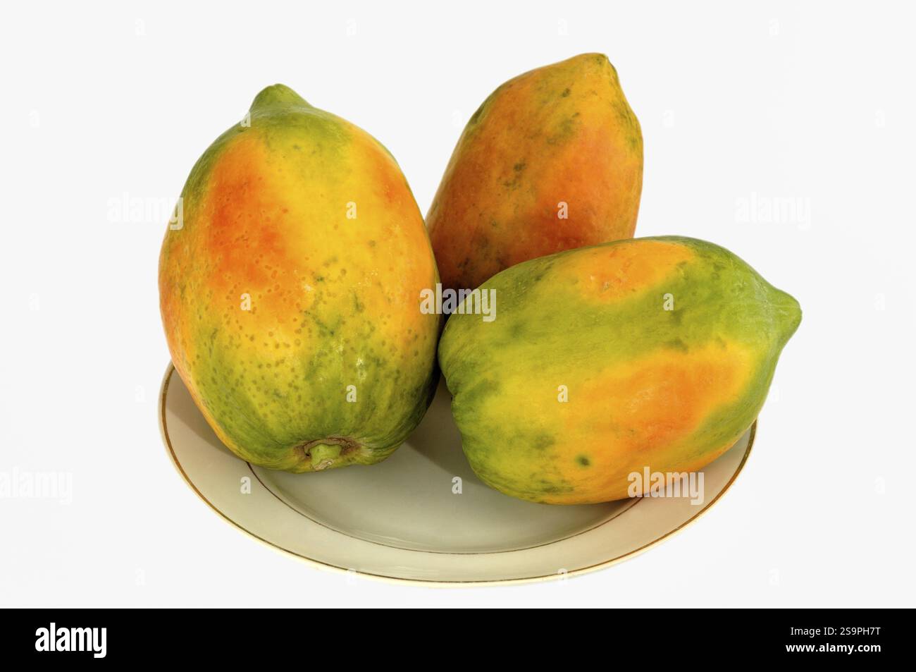 Fruits, three full Pawpaw kept in a plate on white background Stock ...