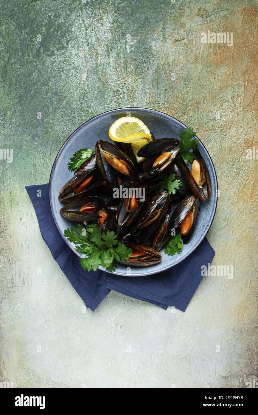 Mussels in shells, boiled in their own juice, in a bowl, top view ...