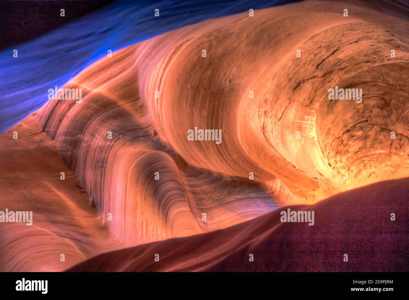 The image is of a rocky cliff with a blue and purple hue. The colors ...