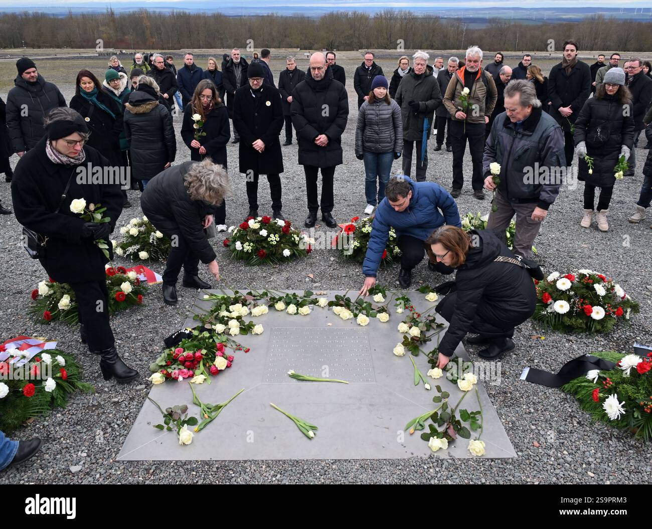Weimar, Germany. 27th Jan, 2025. Participants in a wreath-laying ...