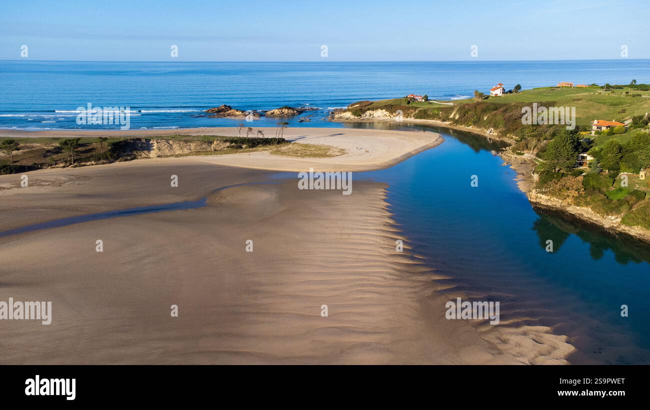 The Ría de la Rabía river and its estuary curve around the sandy Playa ...