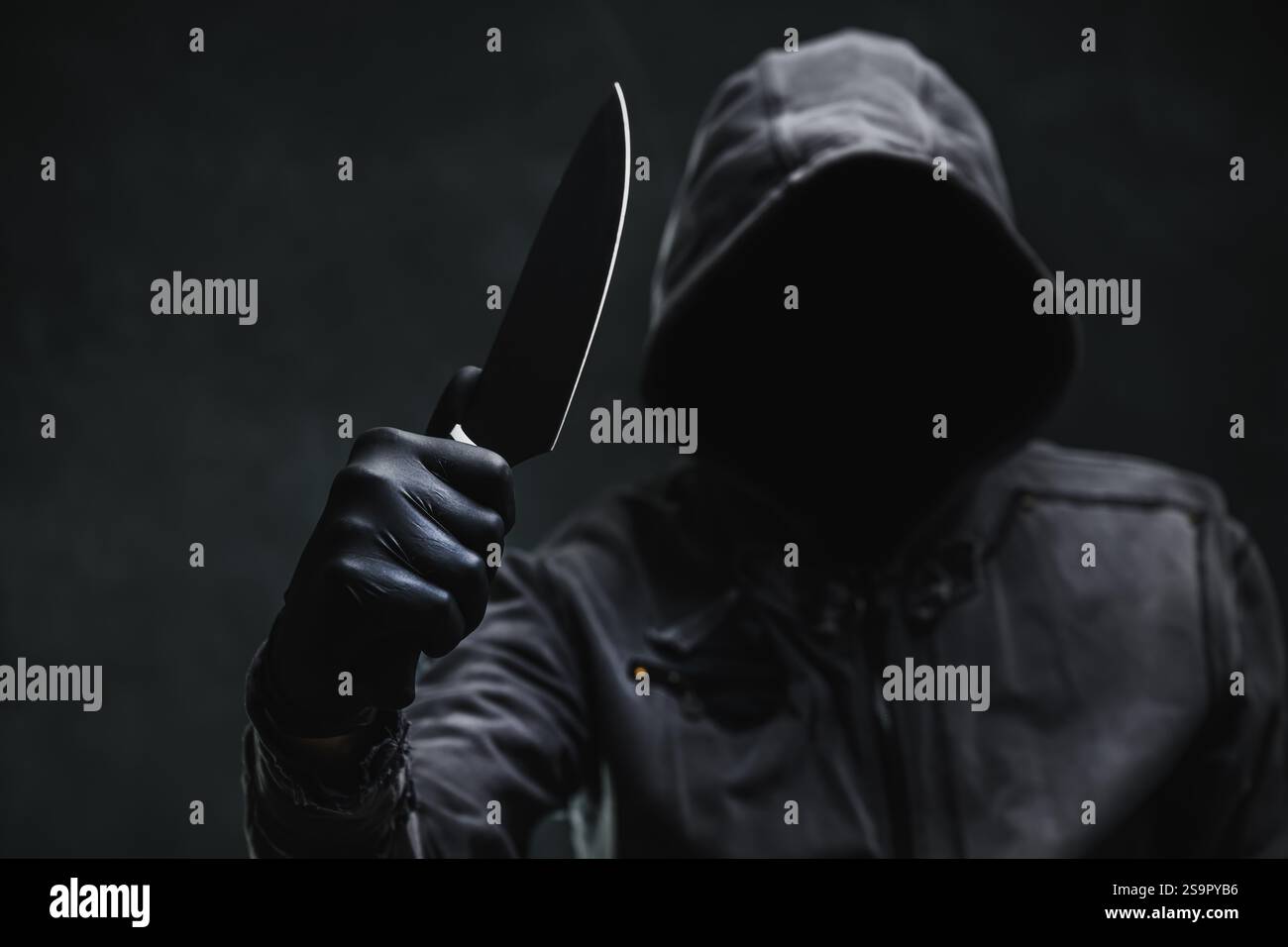 Selective focus unrecognizable hooded hi-res stock photography and ...