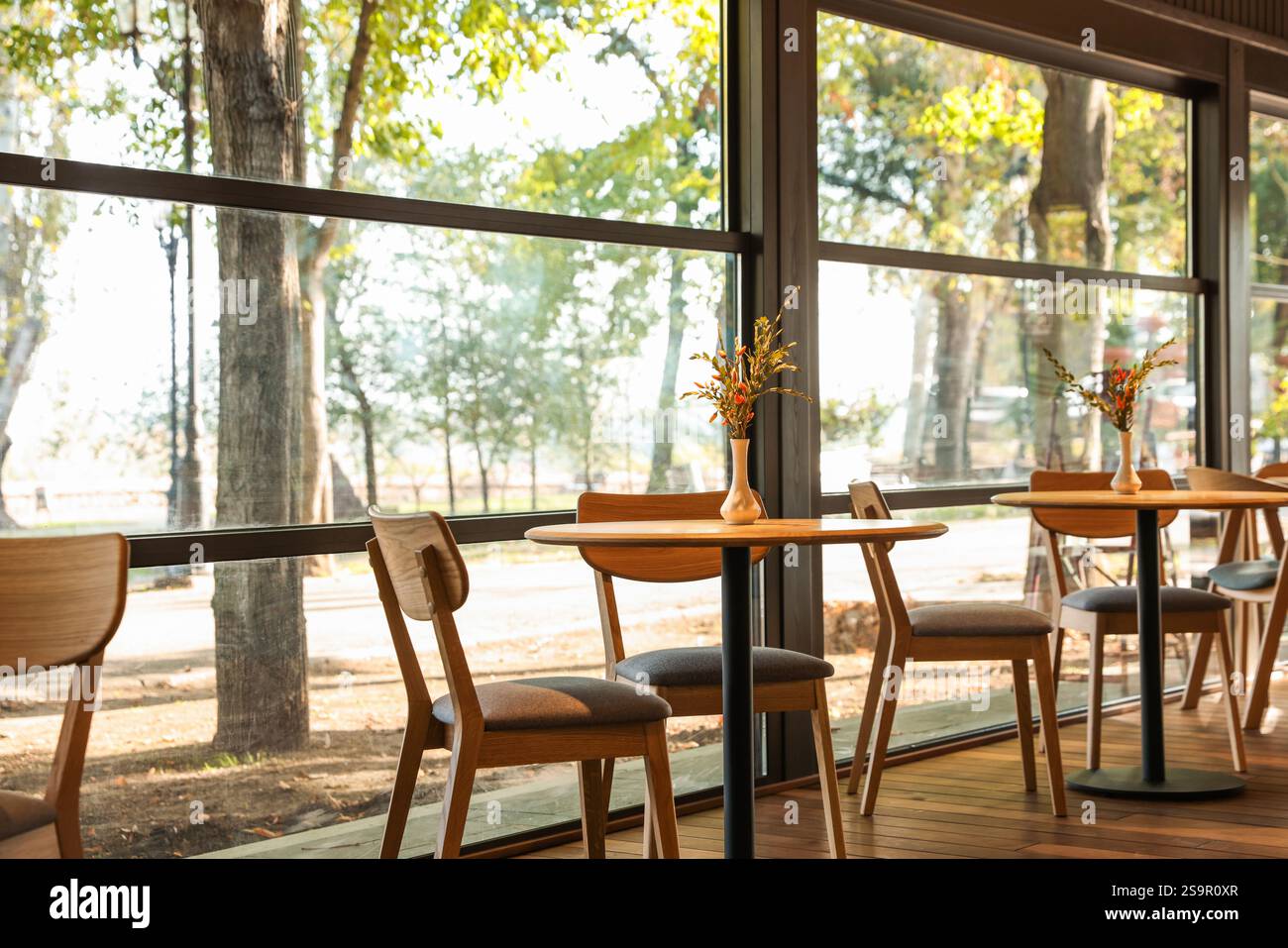 Stylish cafe with large windows. Interior design Stock Photo - Alamy