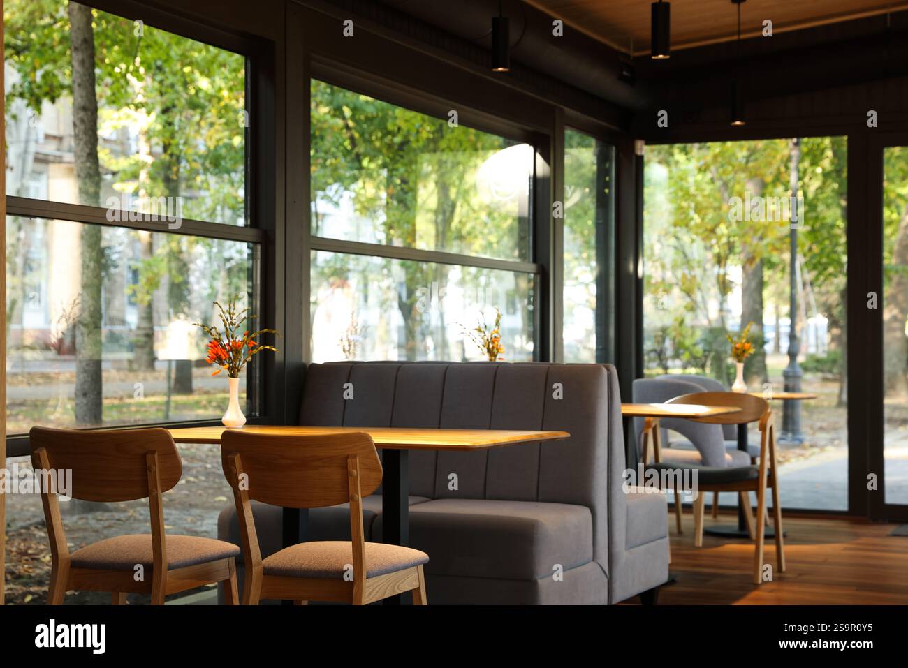 Stylish cafe with large windows. Interior design Stock Photo - Alamy