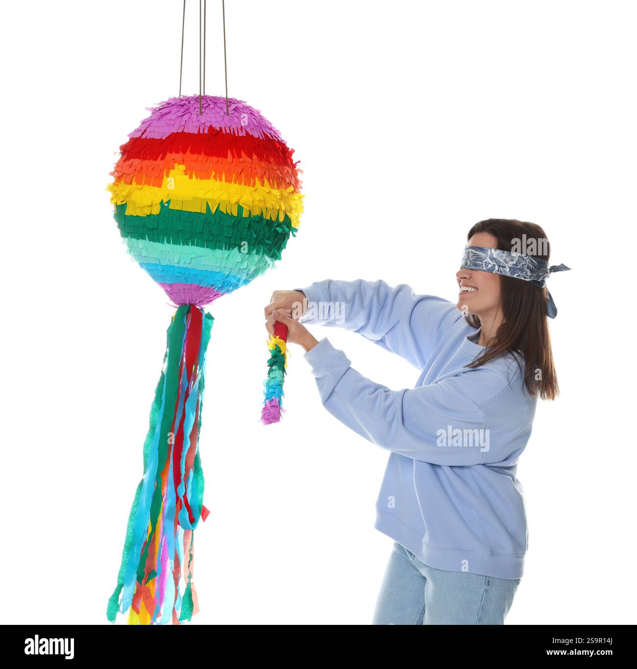 Woman with tied eyes breaking pinata on white background Stock Photo ...