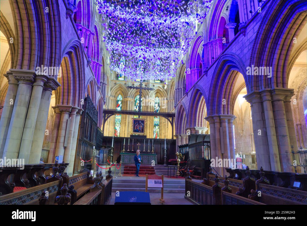 Internal photograph of 12th century Hexham Abbey with origami 'stars ...