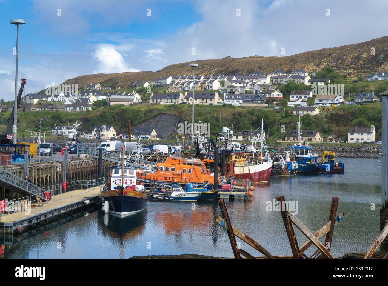 Looking north east from busy Mallaig harbour towards village of Mallaig ...