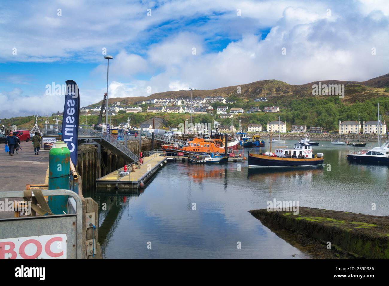 Looking north east from busy Mallaig harbour towards village of Mallaig ...