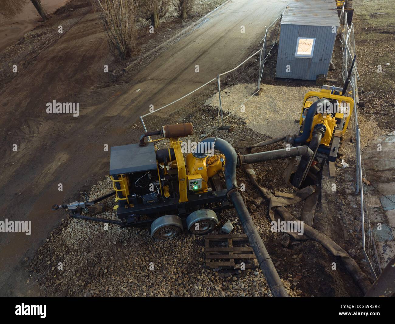 Cleaning sewer manholes by specialized pump machine on the street Stock ...