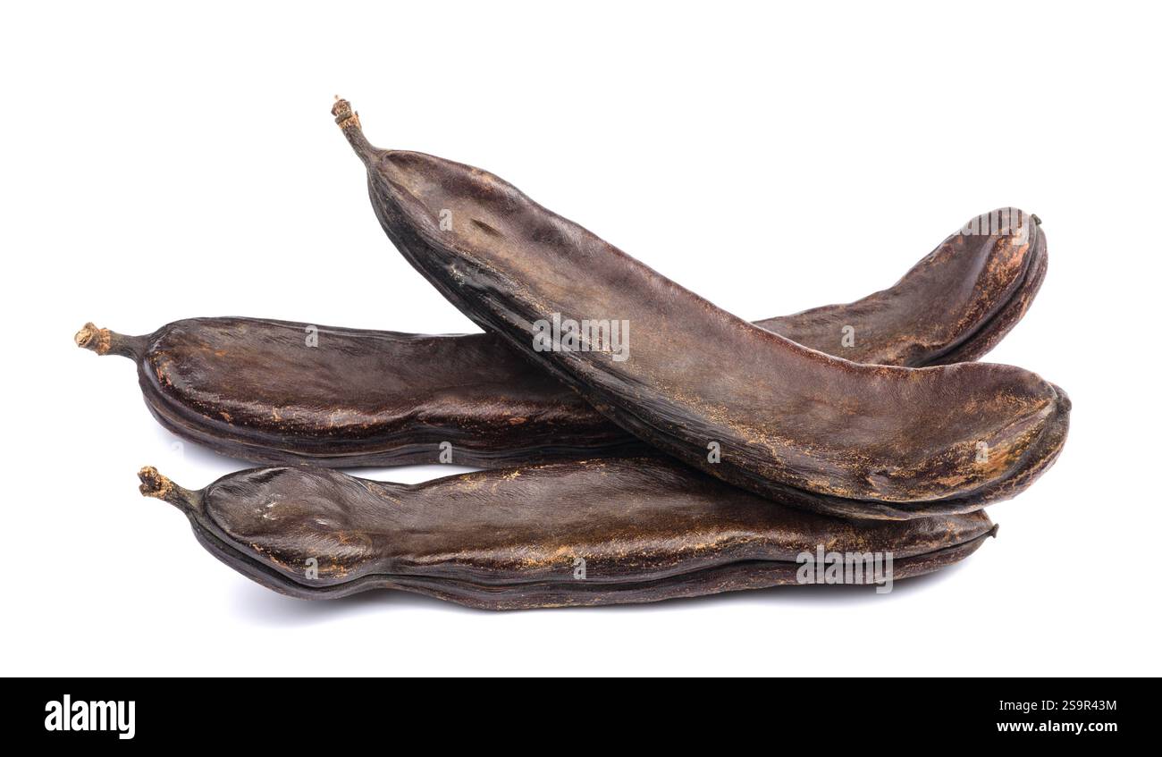 Carobs isolated on white background Stock Photo - Alamy