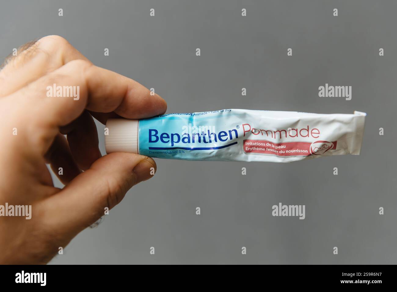 Paris, France - Jan 18, 2025: A hand holding a tube of Bepanthen ...