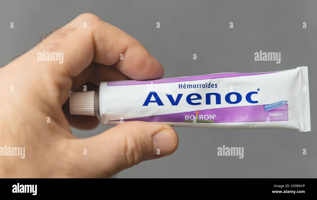 Paris, France - Jan 18, 2025: A hand holding a tube of Avenoc ointment ...
