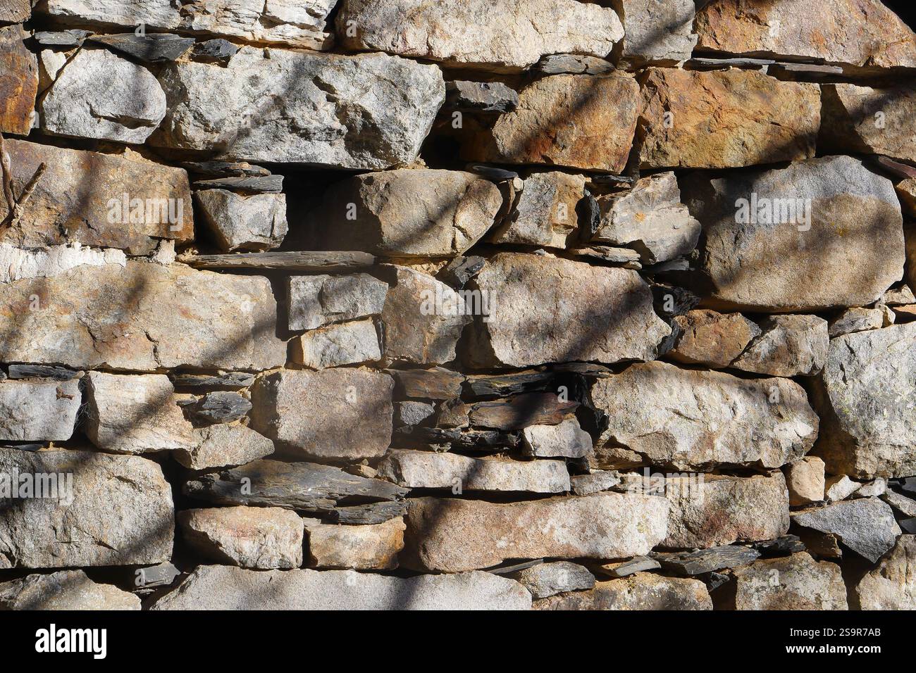 Stone wall constructed from various rock types, showcasing nature's ...