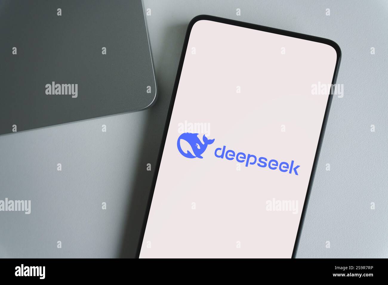 A smartphone displaying the Deepseek logo, a prominent Chinese AI ...