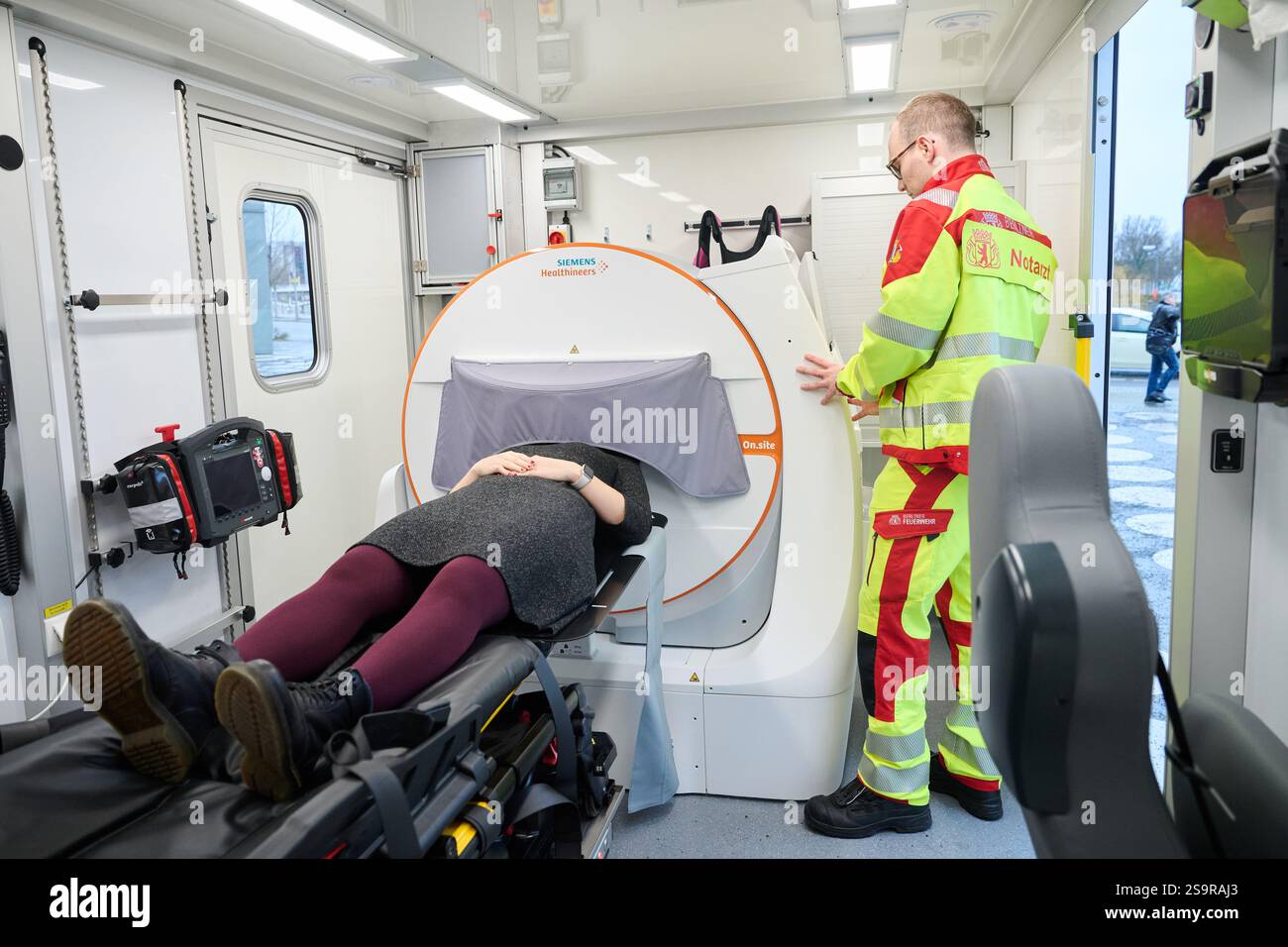 Berlin, Germany. 27th Jan, 2025. A woman lies in a CT scanner in a ...