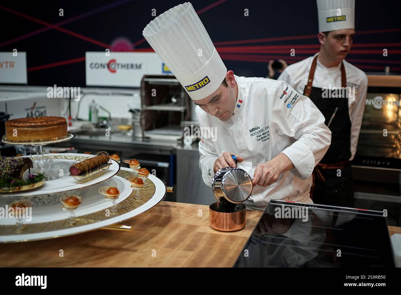 French chef Paul Marcon prepares food during the final of the "Bocuse d'Or" (Golden Bocuse ...