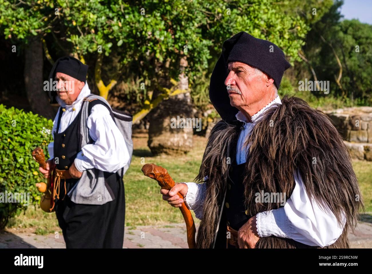 Two of traditionally dressed old men taking part in the Madonna di ...