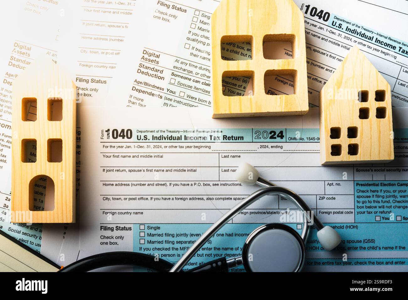 Federal income tax return preparation with 1040 form and calculator for ...