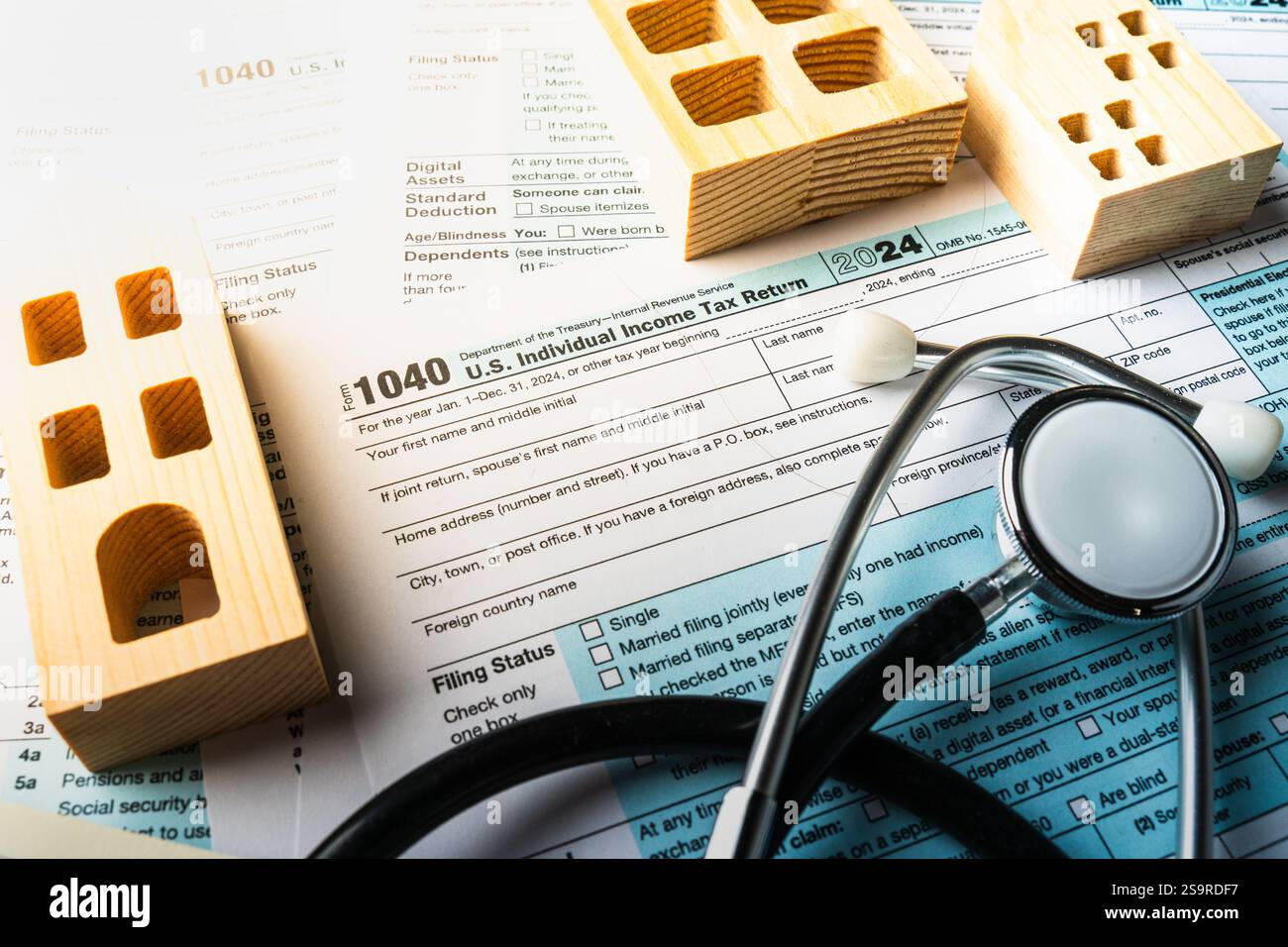 Federal income tax return preparation with 1040 form and calculator for ...