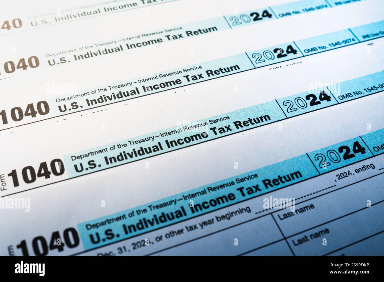 Federal income tax return preparation with 1040 form and calculator for ...