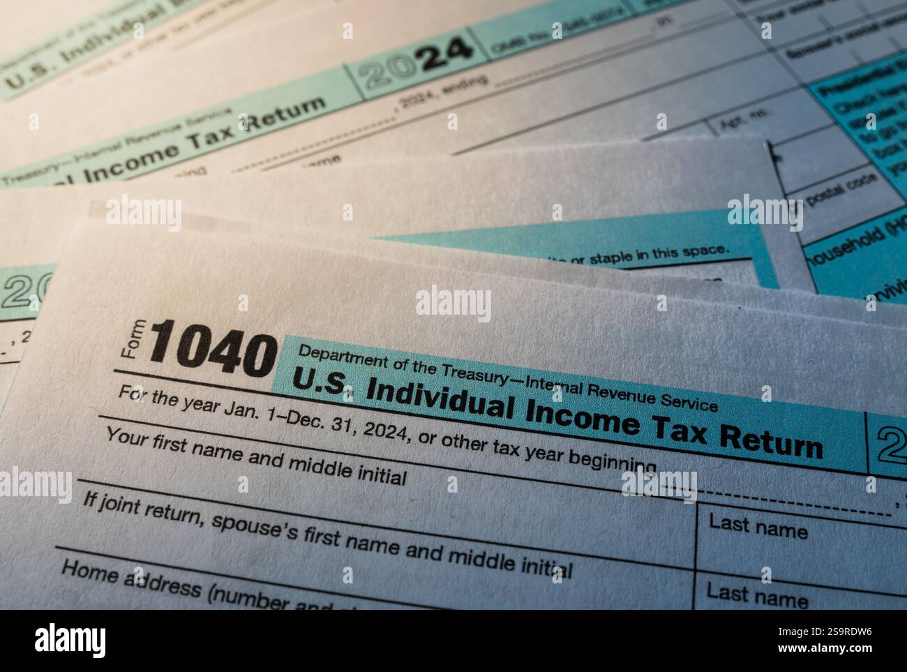 Federal income tax return preparation with 1040 form and calculator for ...