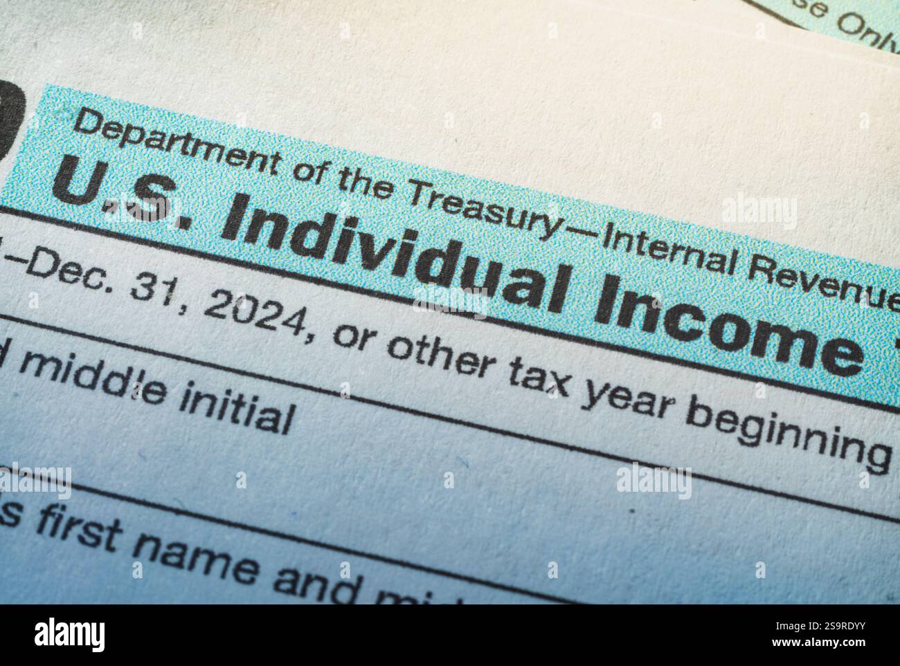 Federal income tax return preparation with 1040 form and calculator for ...