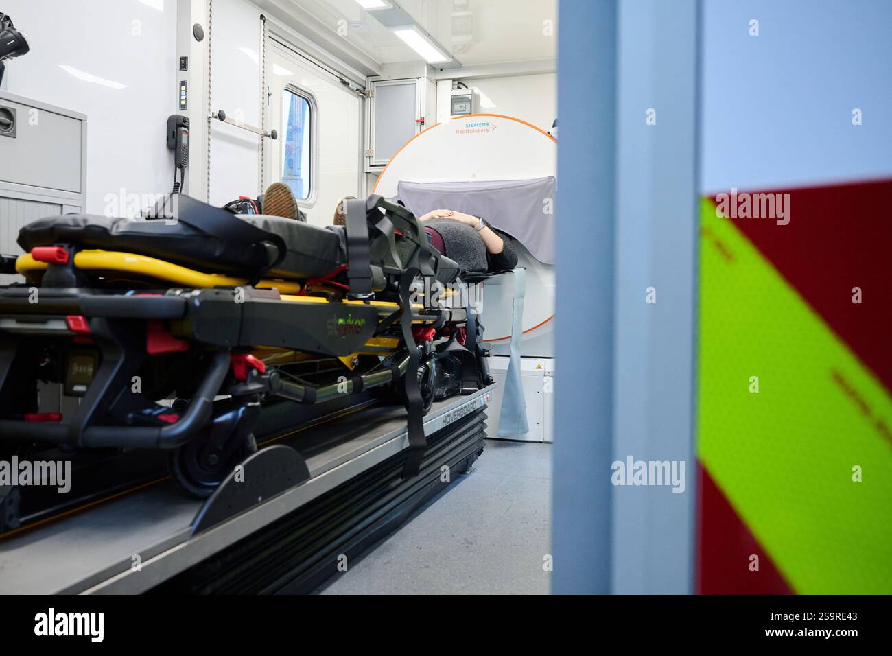 27 January 2025, Berlin: A woman lies in a built-in computer tomograph ...