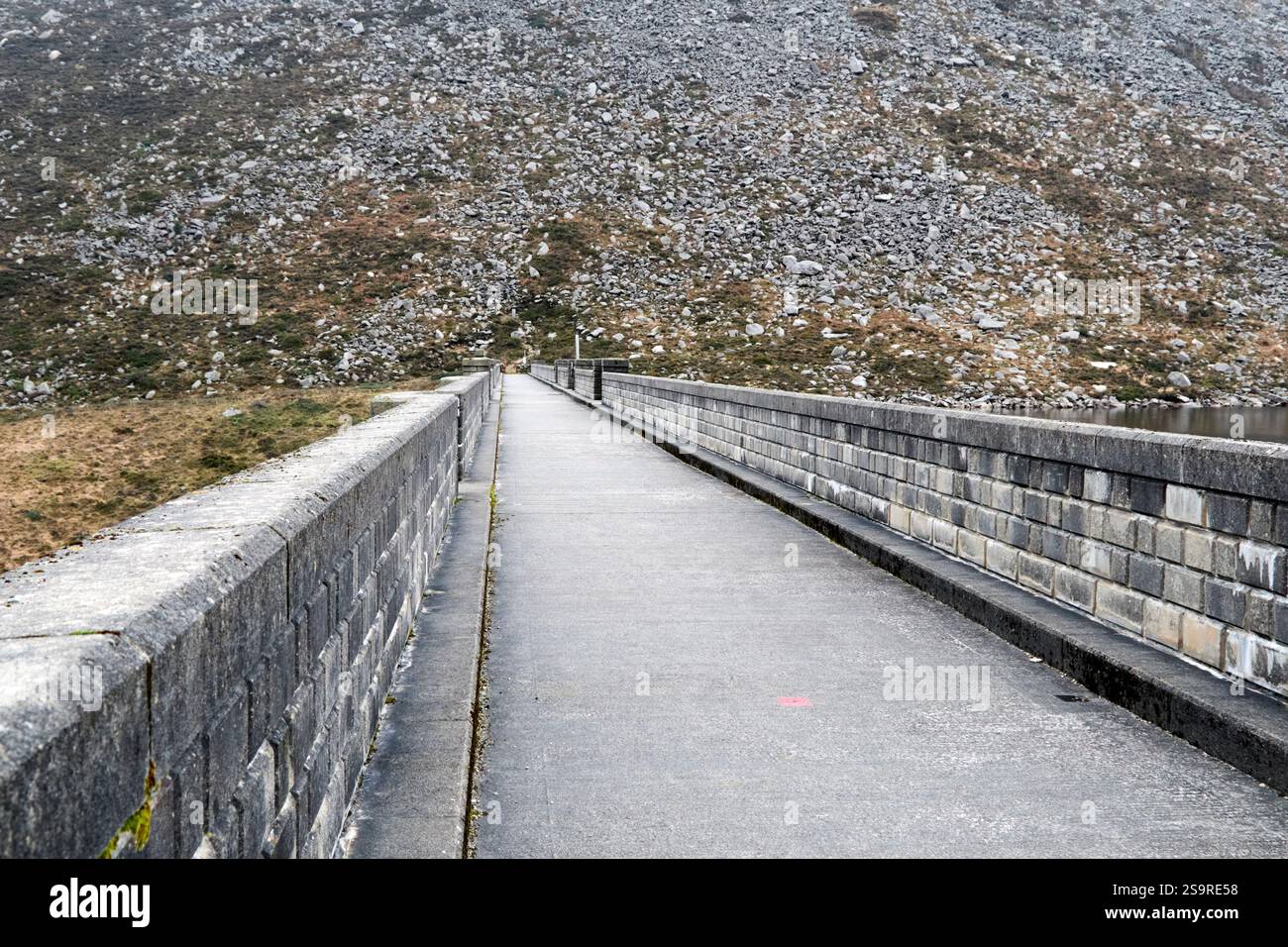 walkway across the top of the ben crom dam and reservoir in the silent ...