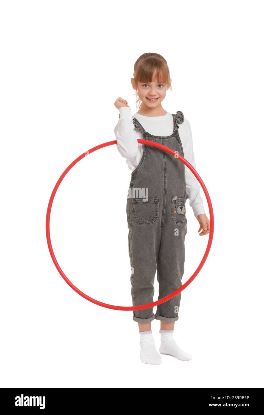 Cute little girl with hula hoop on white background Stock Photo - Alamy