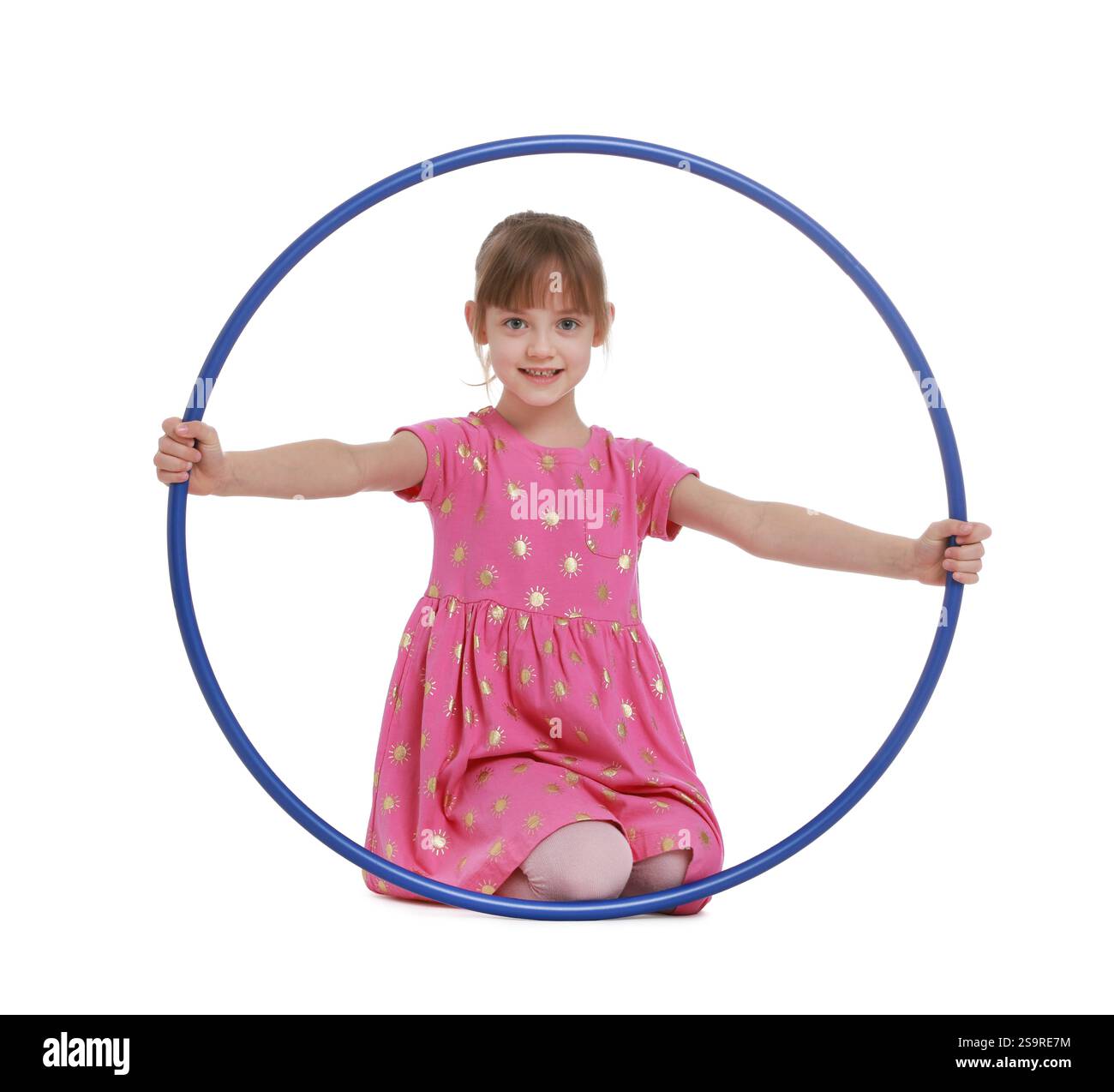 Cute little girl with hula hoop on white background Stock Photo - Alamy