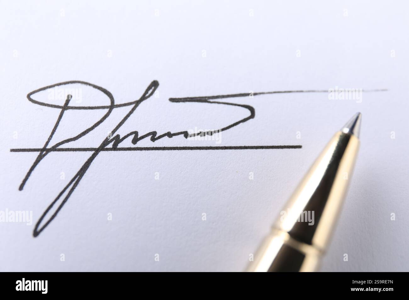 Pen and signature on white paper, closeup Stock Photo - Alamy
