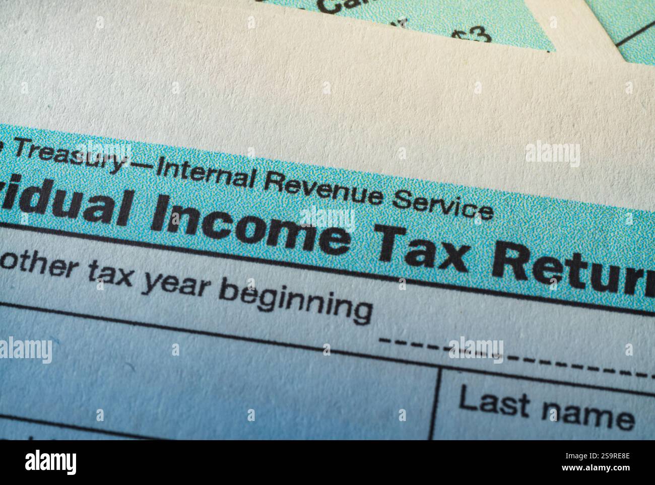 Federal income tax return preparation with 1040 form and calculator for ...