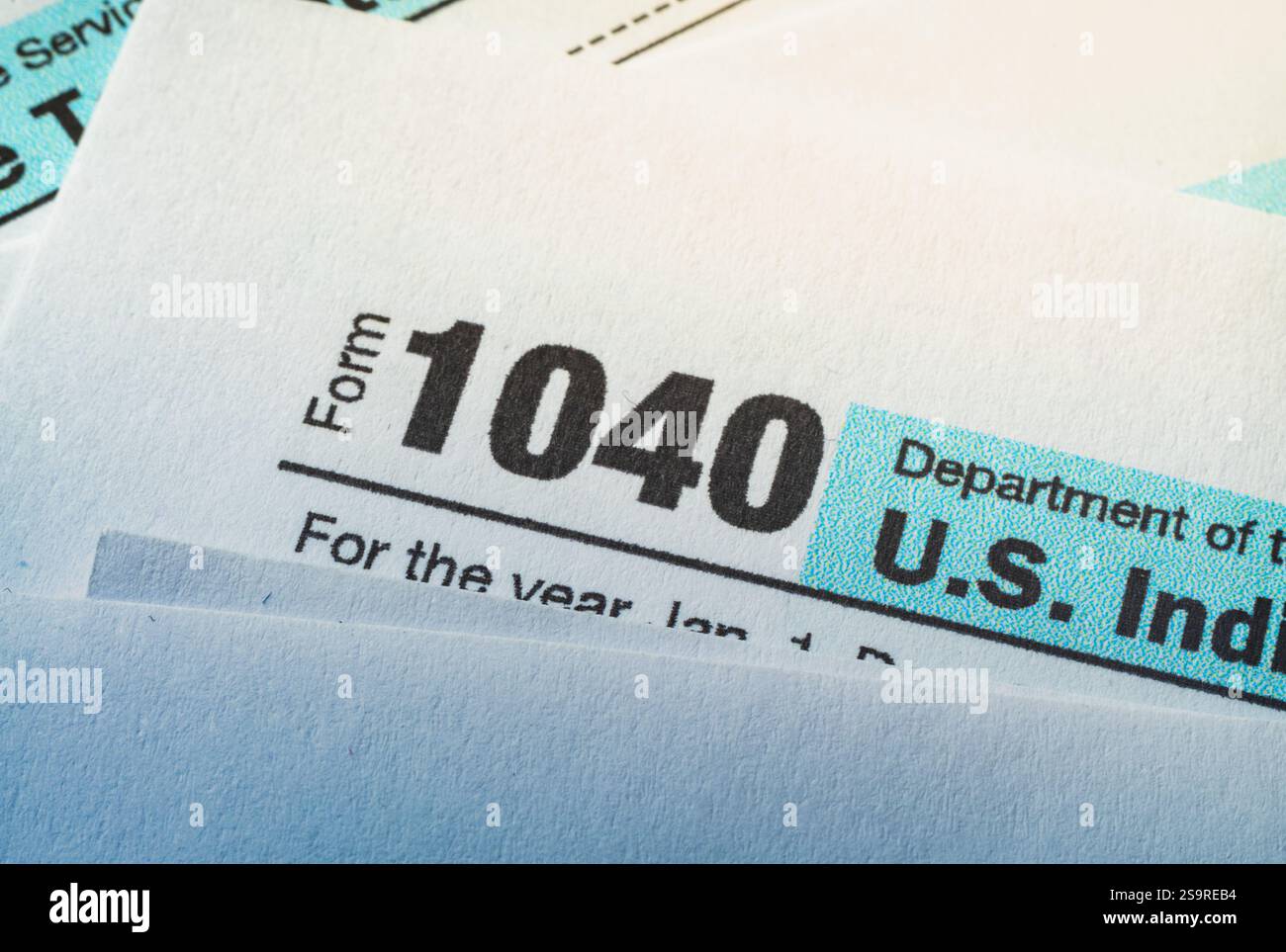 Federal income tax return preparation with 1040 form and calculator for ...